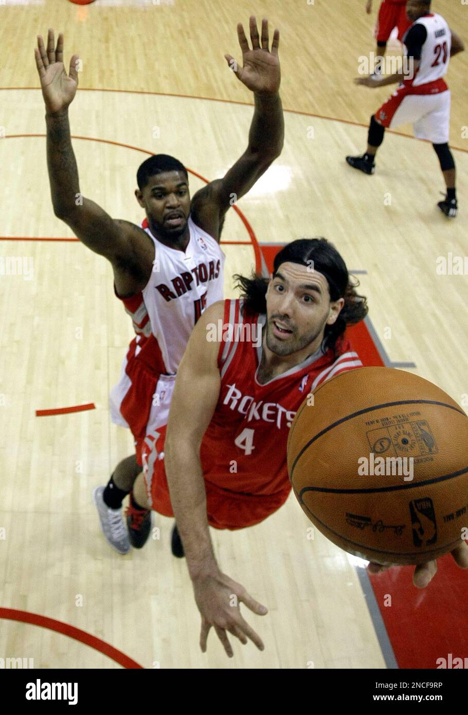 Houston Rockets' Luis Scola (4), of Argentina, goes up for a shot as ...