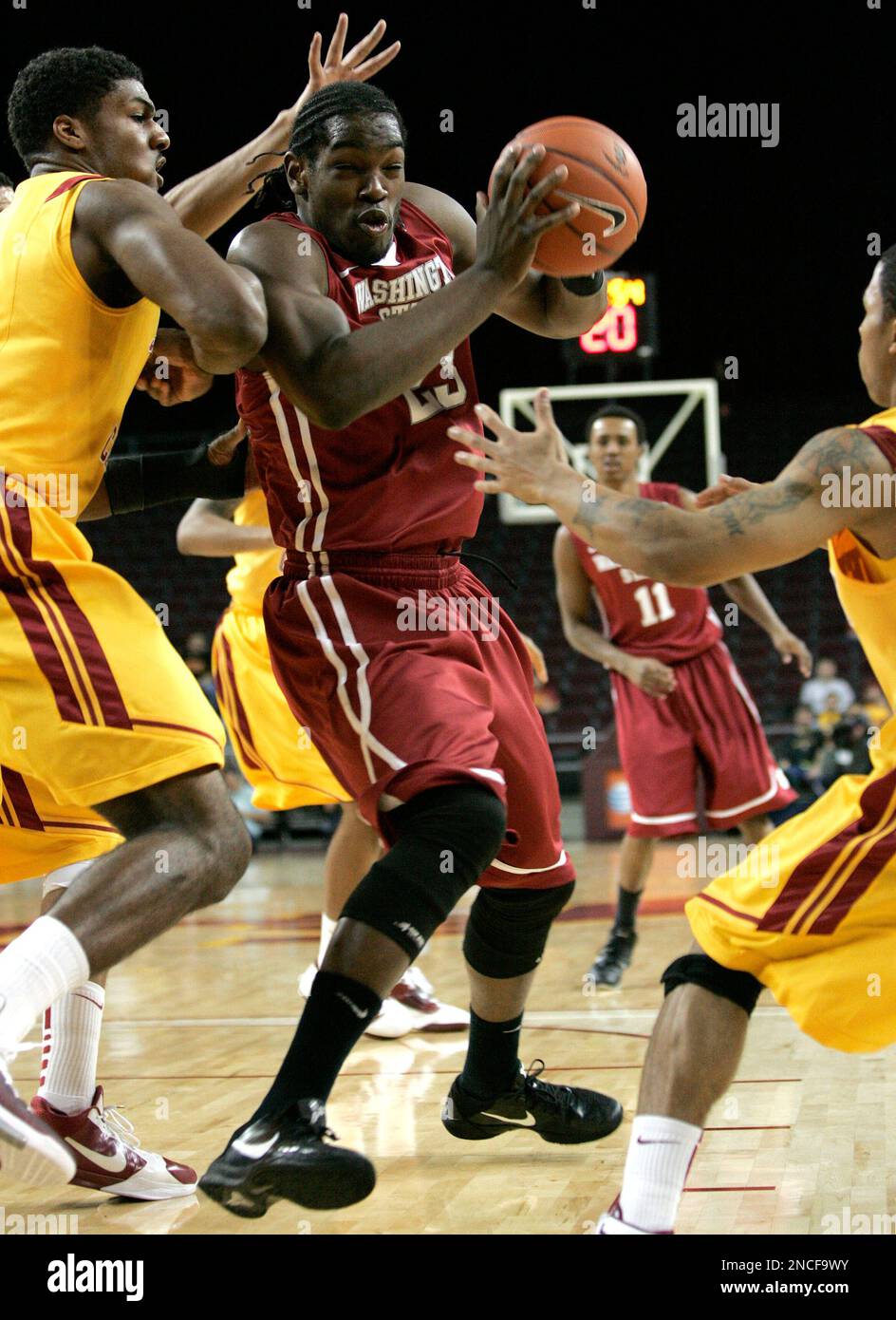 Washington State forward DeAngelo Casto, center, works Southern ...