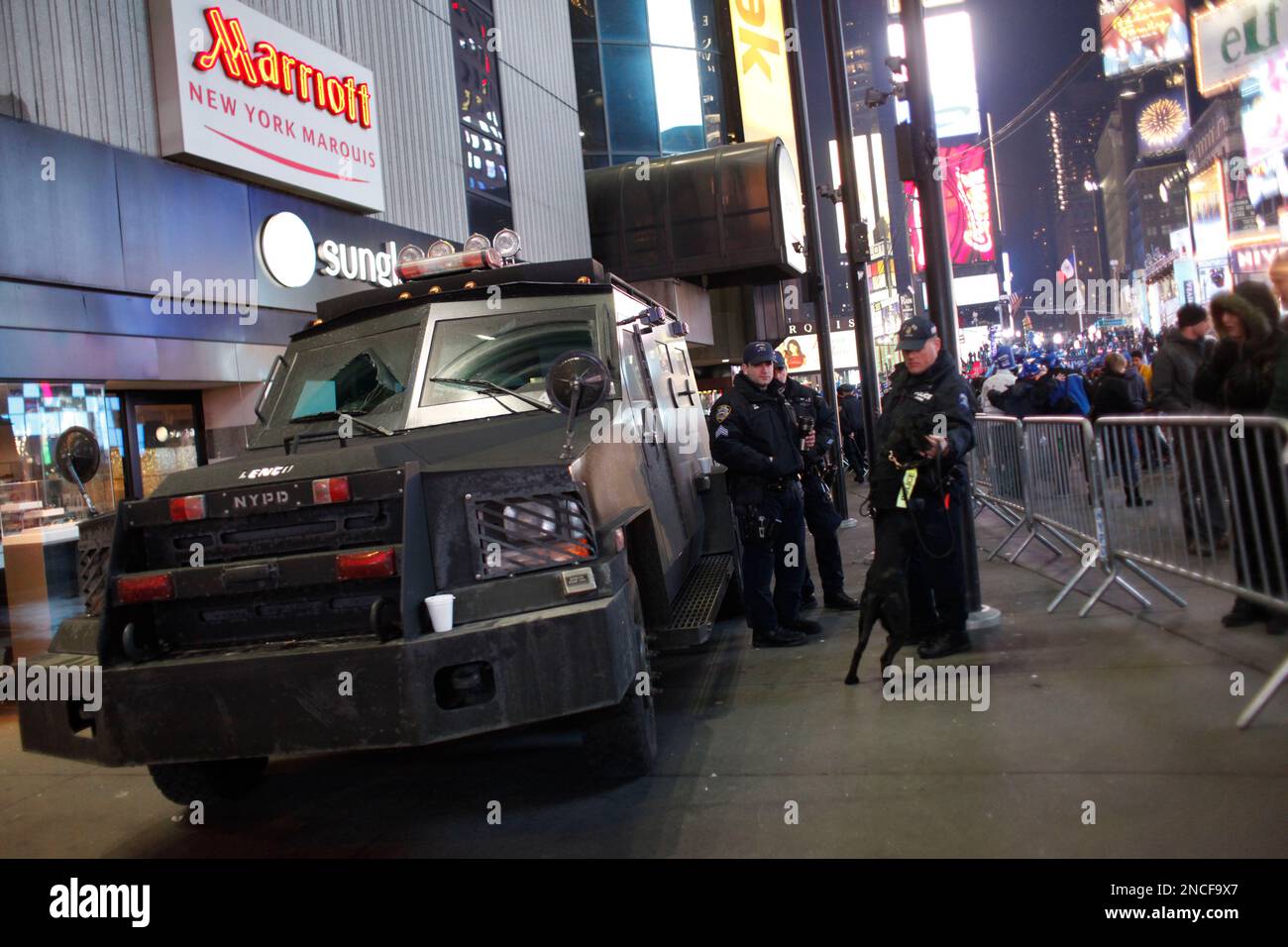 New York city police officers with a bomb sniffing dog and an armored ...