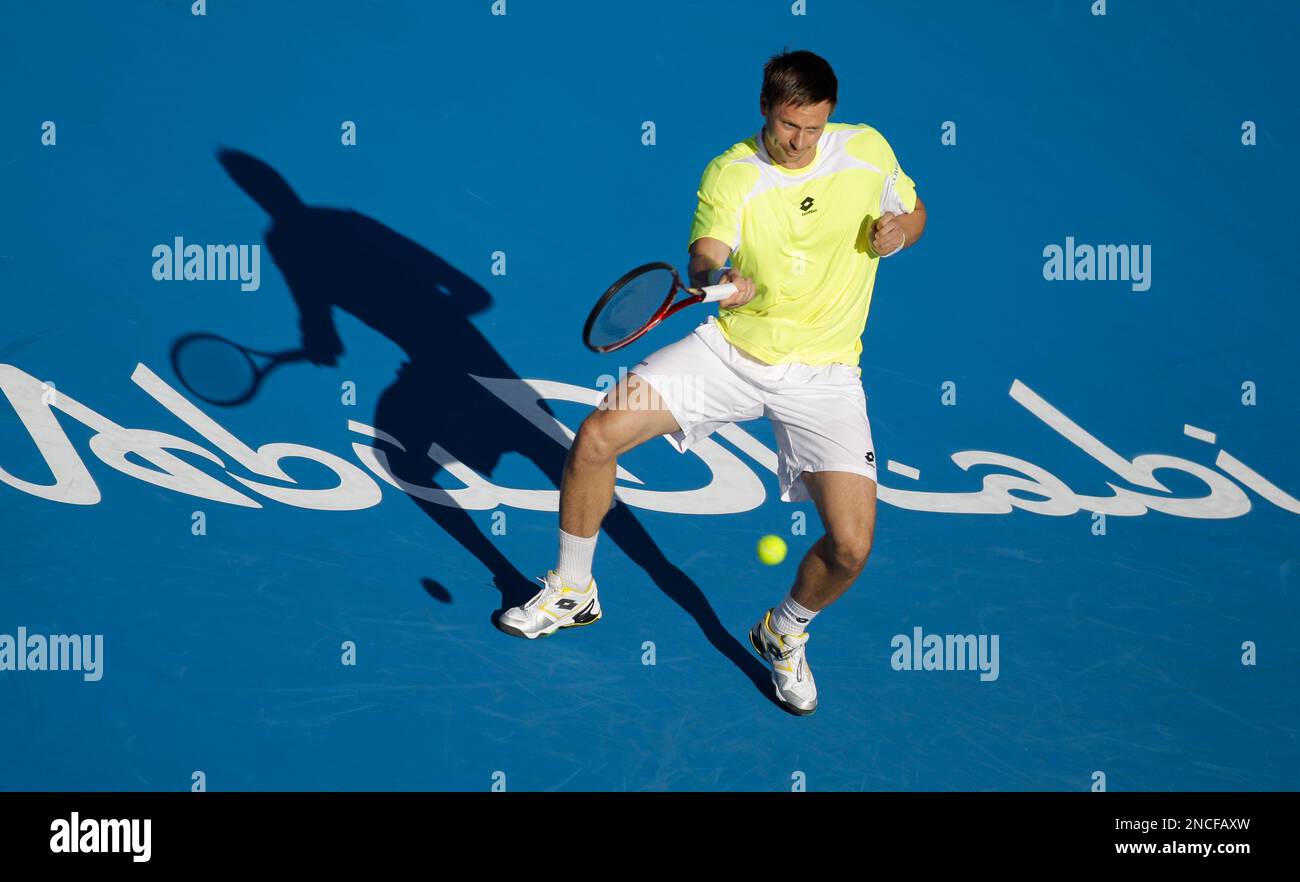 Robin Soderling from Sweden returns the ball to Roger Federer from ...