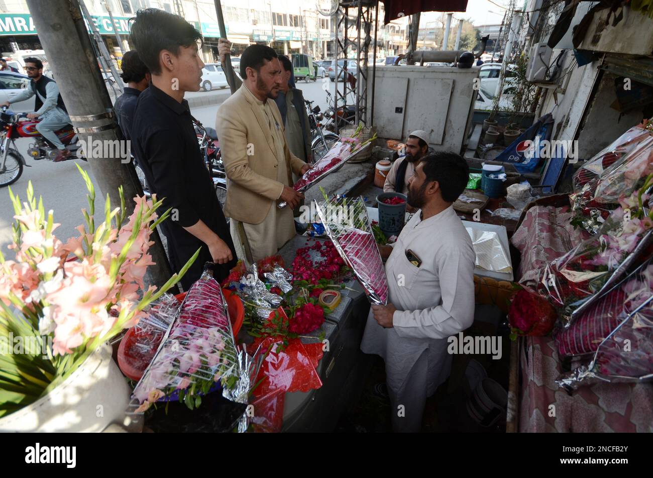 Peshawar, Khyber Pakhtunkhwa, Pakistan. 14th Feb, 2023. People buy ...
