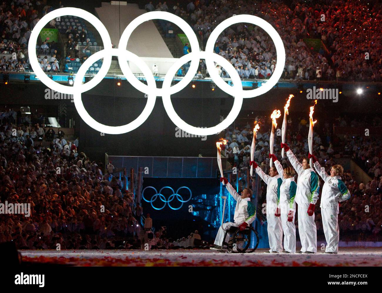 Torchbearers Rick Hansen, left to right, Wayne Gretzky, Catriona Lemay ...