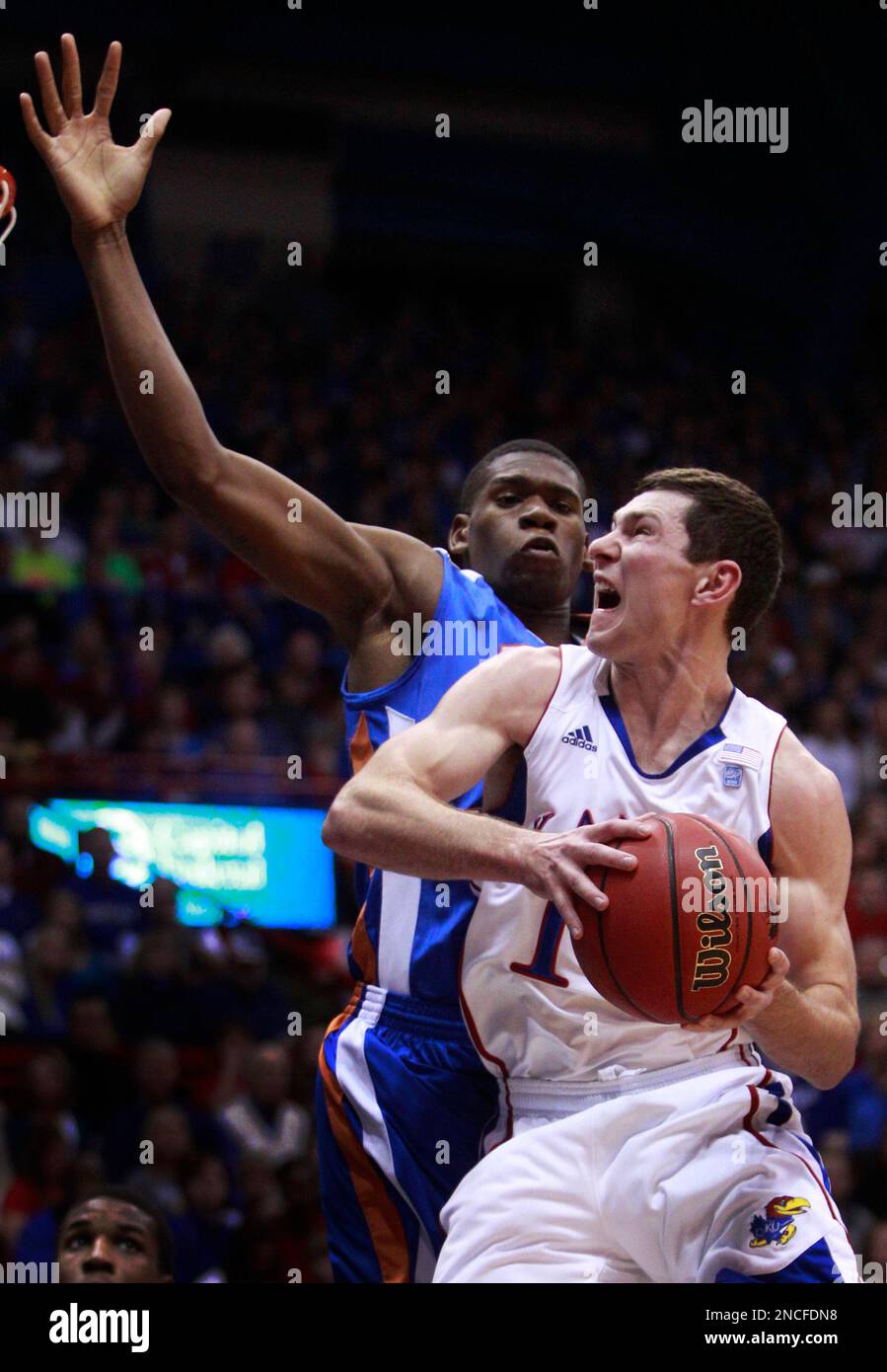 Kansas guard Tyrel Reed (14) drives the lane against Texas-Arlington ...