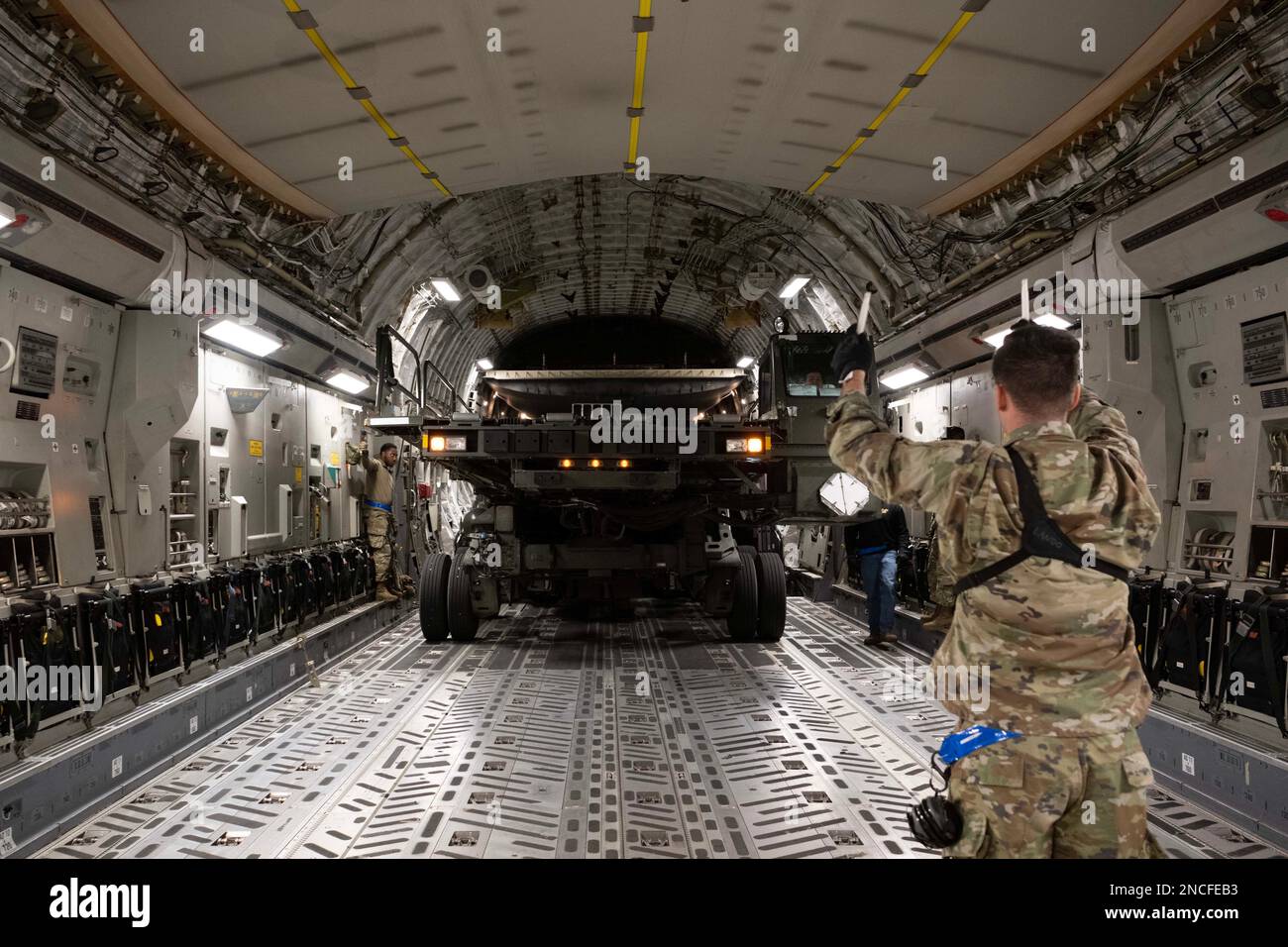 U.S. Air Force Staff Sgt. Anthony Orlando, right, 60th Aerial Port ...