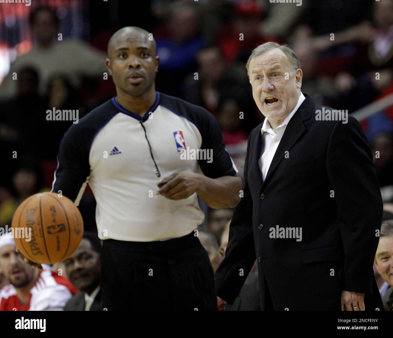 Houston Rockets head coach Rick Adelman, right, yells at an official ...