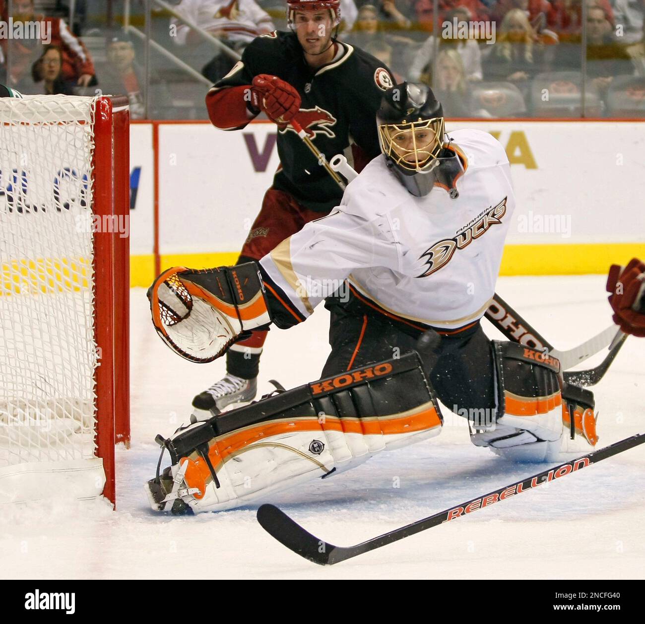 Anaheim Ducks goaltender Jonas Hiller looks to stop the shot of Phoenix ...