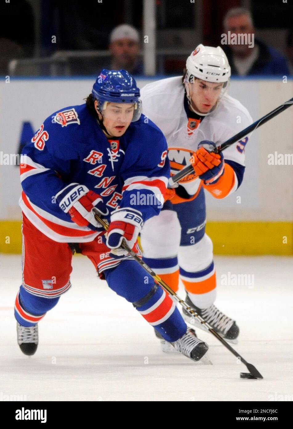 New York Rangers' Mats Zuccarello, right, and New York Islanders' John ...