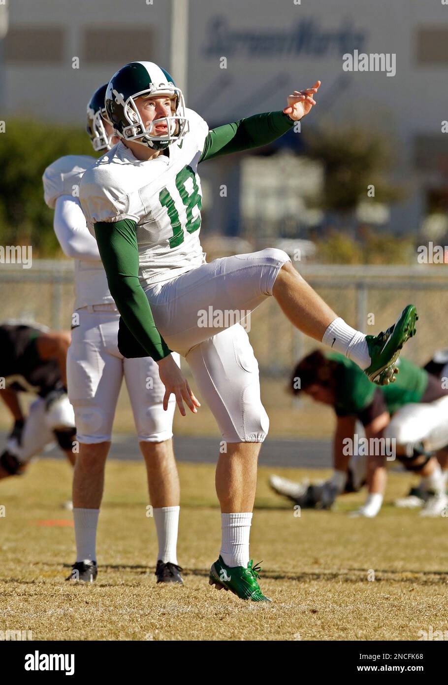Michigan State punter Aaron Bates watches a punt during a practice for ...