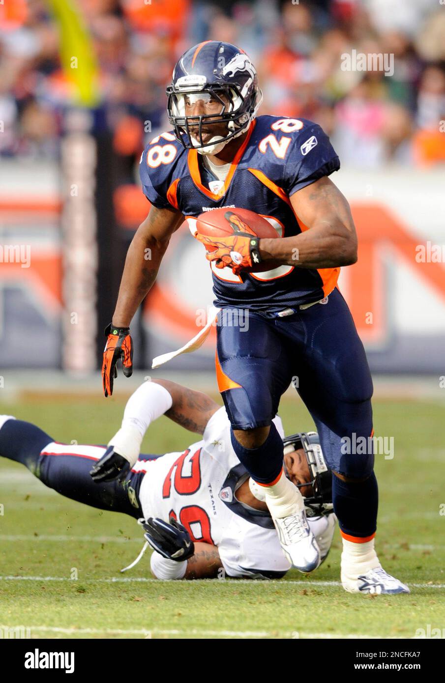 Denver Broncos running back Correll Buckhalter (28) slips a tackle by ...