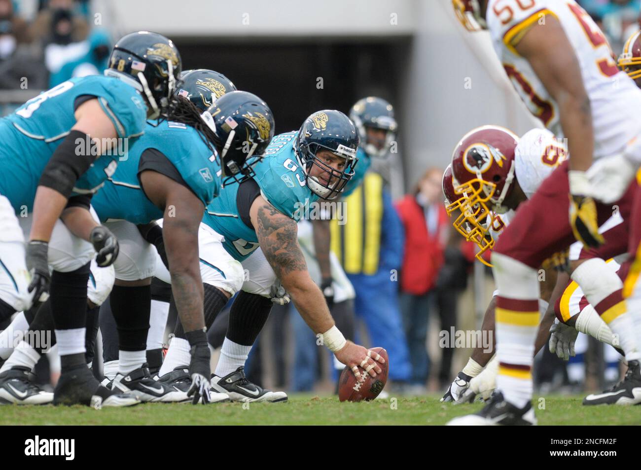 Jacksonville Jaguars center Brad Meester (63), center, leads his team ...
