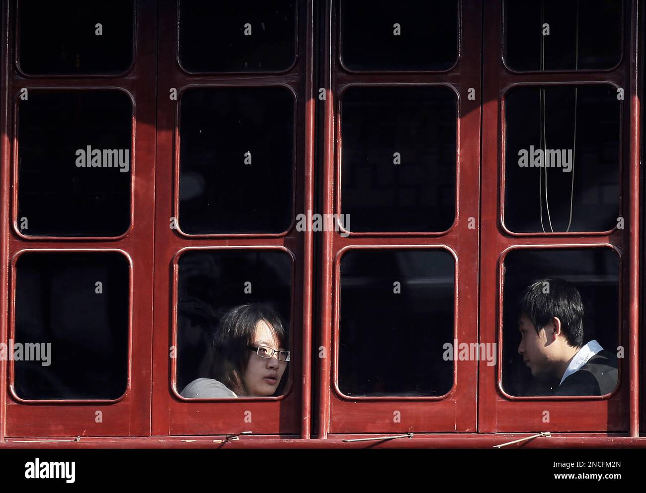 A couple chats at a tea house at Yuyuan Garden, one of the most popular ...