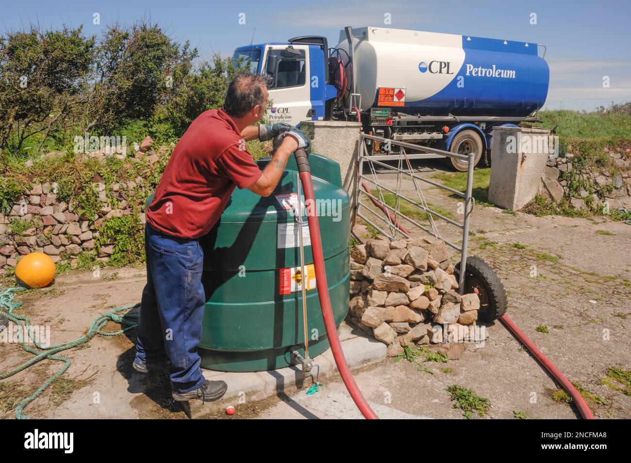 Oil tanker delivering oil in rural area Stock Photo - Alamy