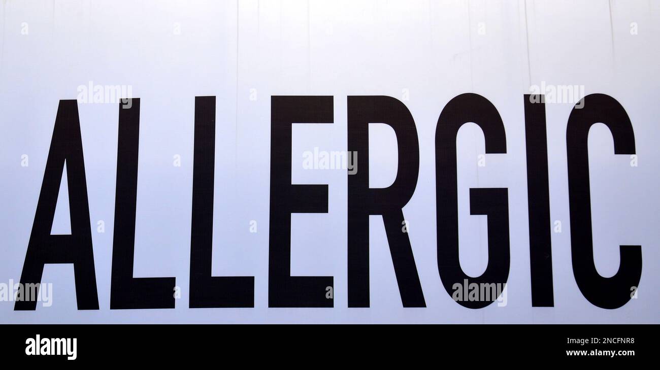 A sign saying: 'ALLERGIC' on a white background Stock Photo - Alamy