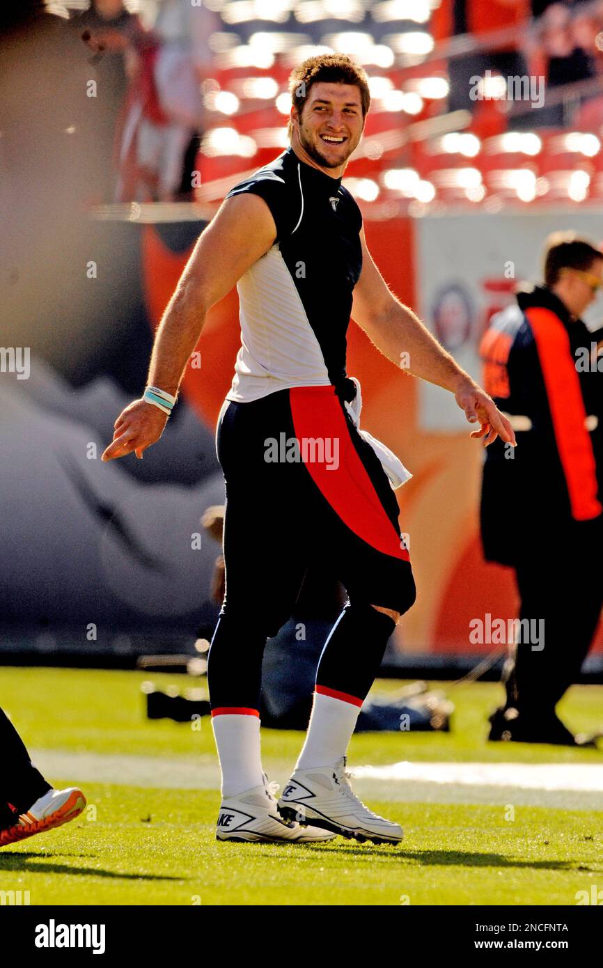 Denver Broncos quarterback Tim Tebow smiles prior to an NFL football ...