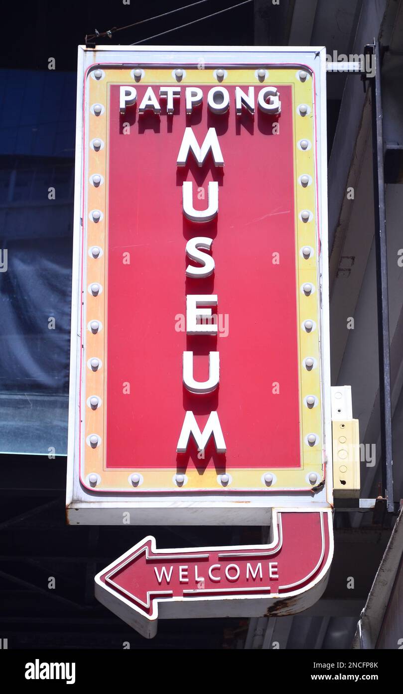A sign directs to the Patpong Museum, a museum about the history of the ...