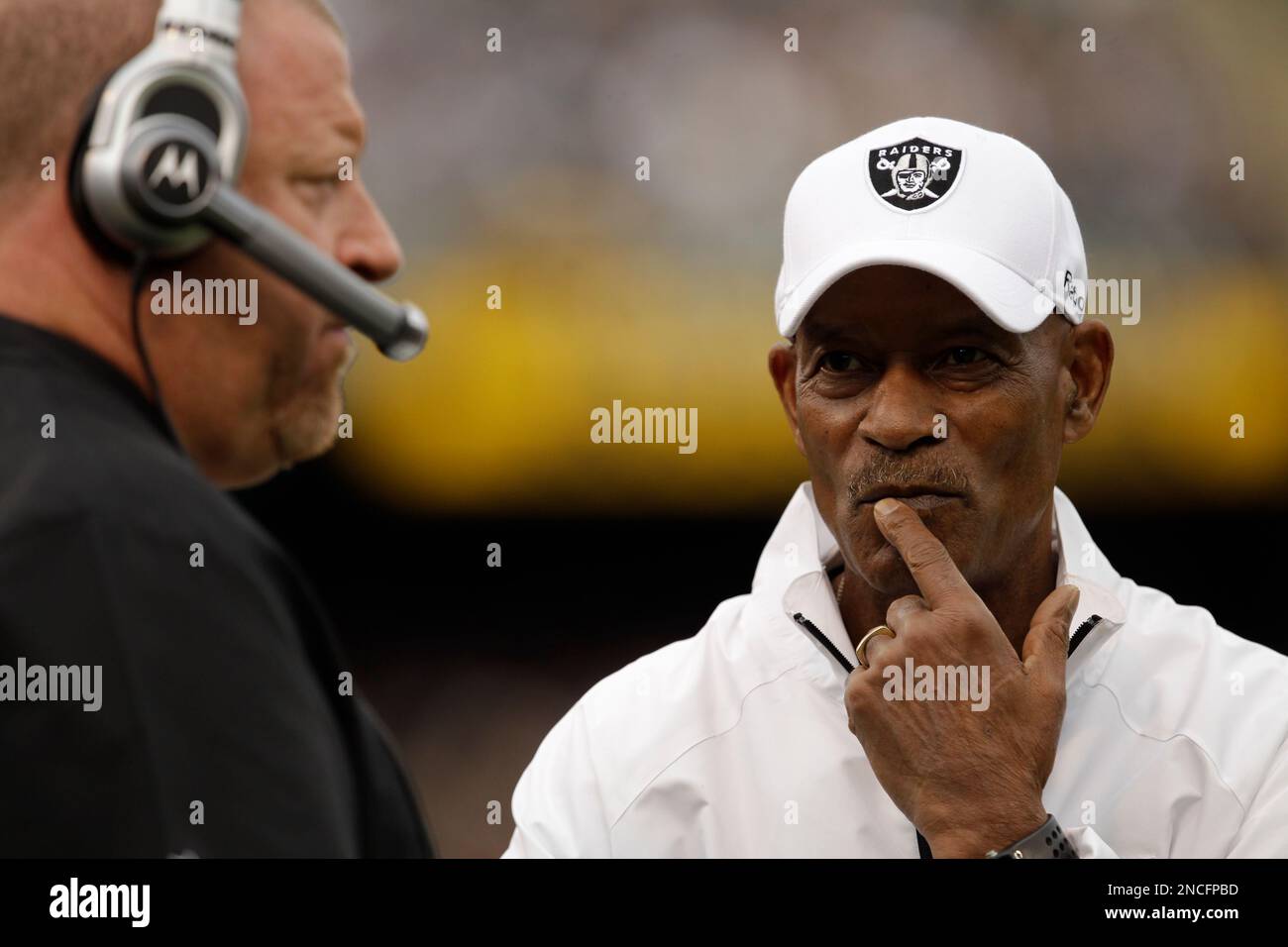 Former NFL player Willie Brown talks with Oakland Raiders head coach ...