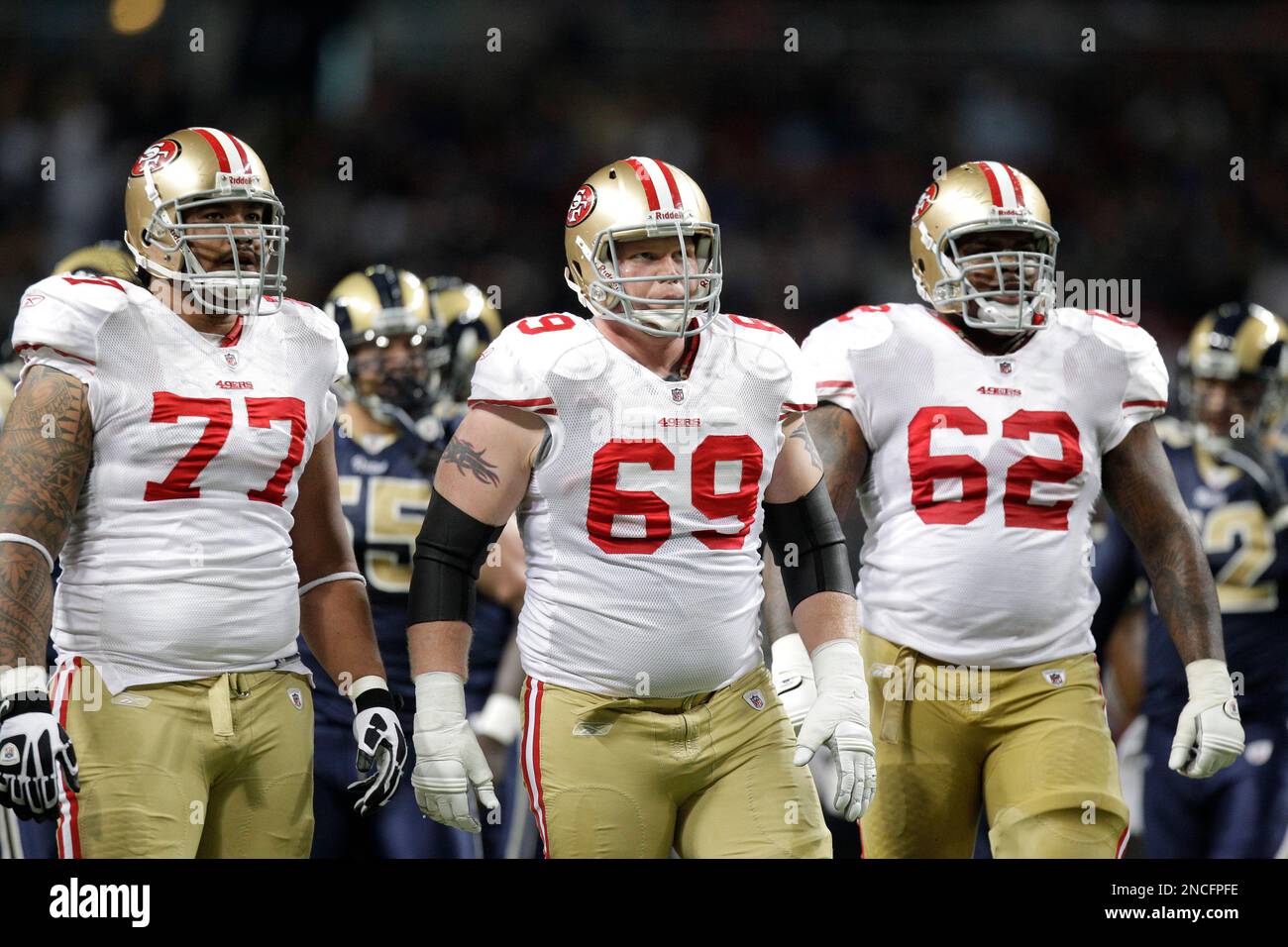 San Francisco 49ers offensive players Mike Iupati (77), Tony Wragge (69 ...
