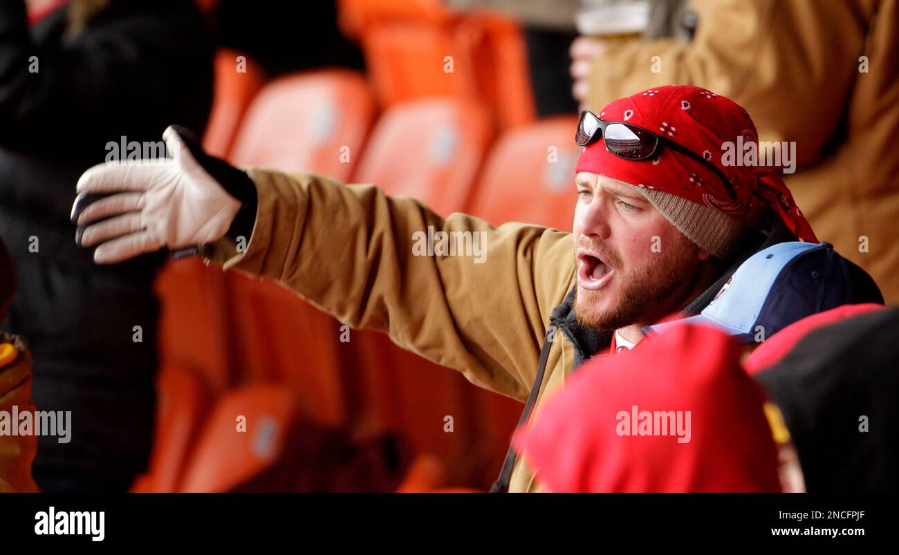 A Kansas City Chiefs fan does a tomahawk chop during an NFL football ...