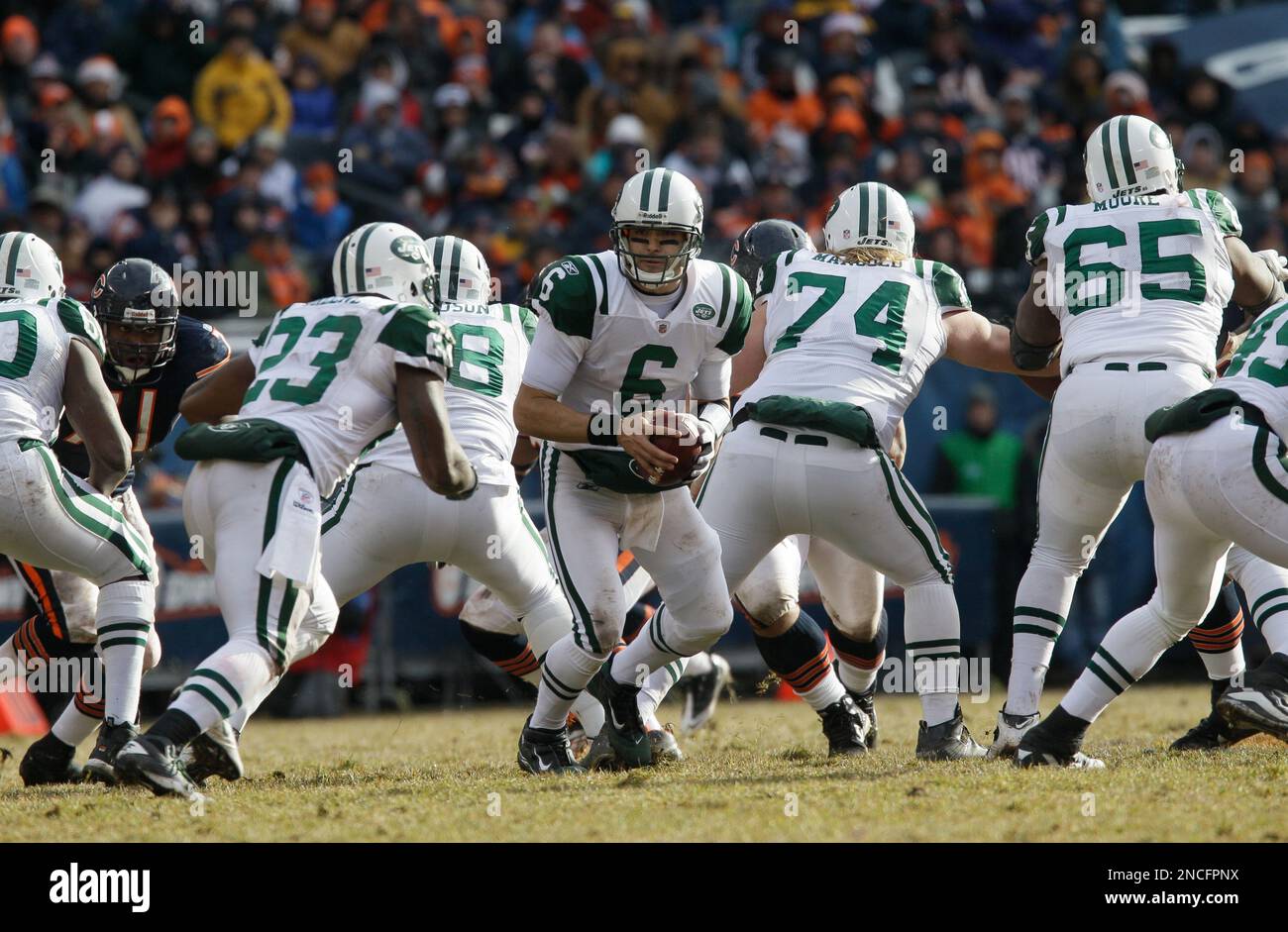 New York Jets quarterback Mark Sanchez prepares to hand off to running ...