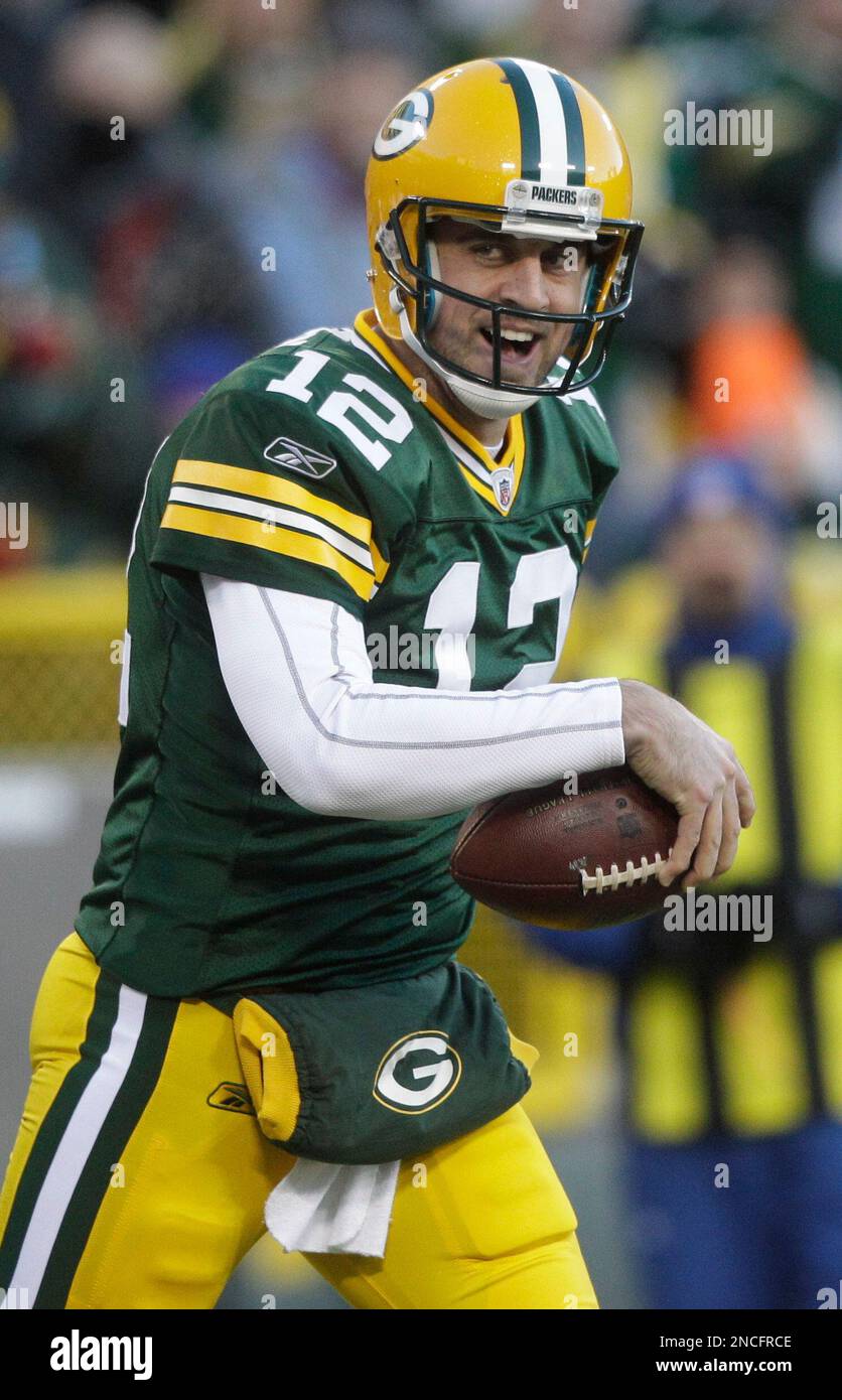 Green Bay Packers quarterback Aaron Rodgers (12) reacts after sliding ...