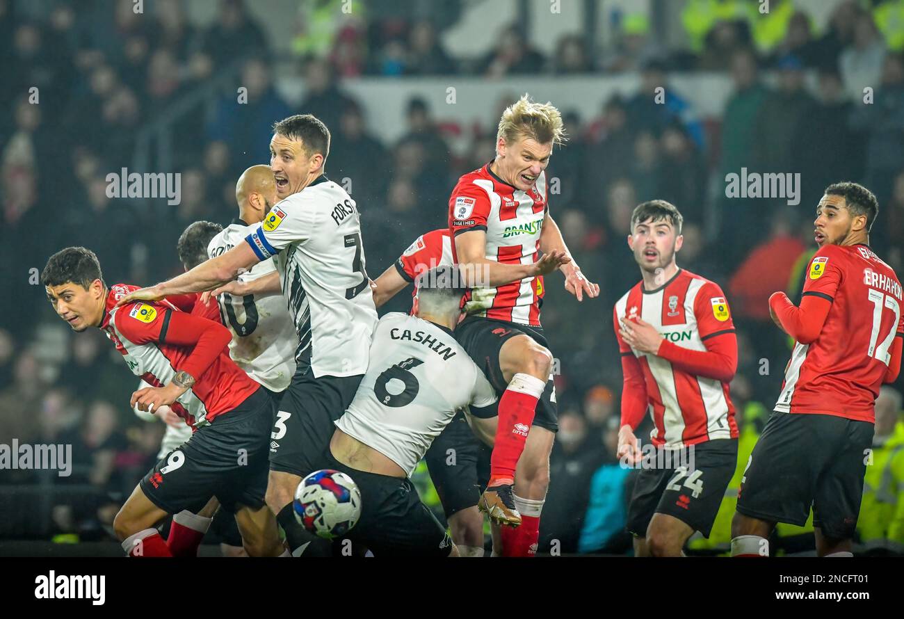 Derby, UK. 14th Feb, 2023. Battling for incoming Derby corner kick ...