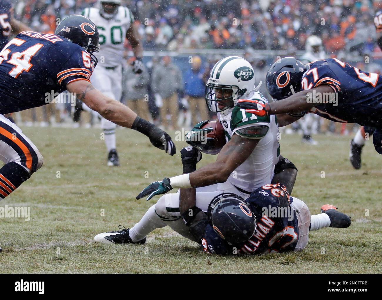 New York Jets wide receiver Braylon Edwards (17) is tackled by Chicago ...