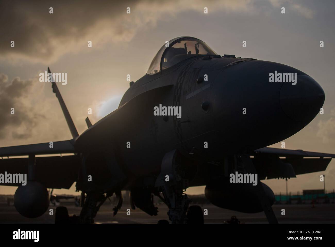A U.S. Marine Corps F/A-18C Hornet aircraft sits staged on the flight ...