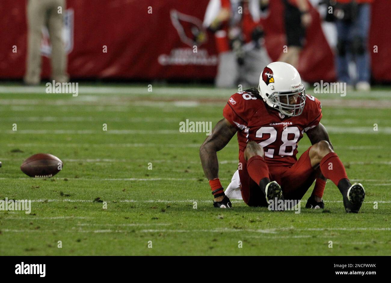 Arizona Cardinals' Greg Toler (28) gets up off the turf after ...