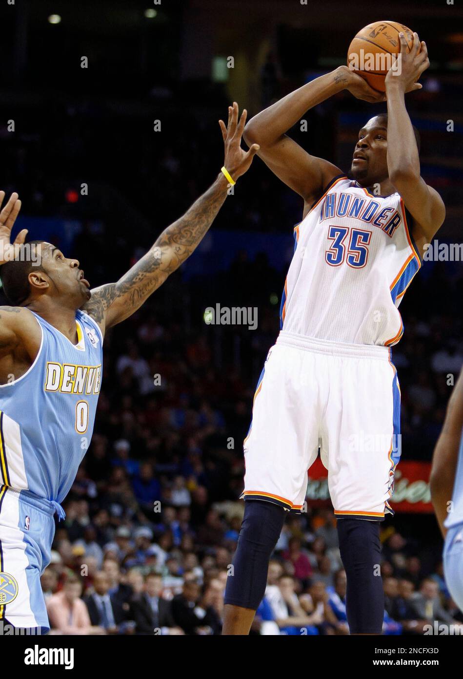 Oklahoma City Thunder forward Kevin Durant, right, shoots over Denver ...