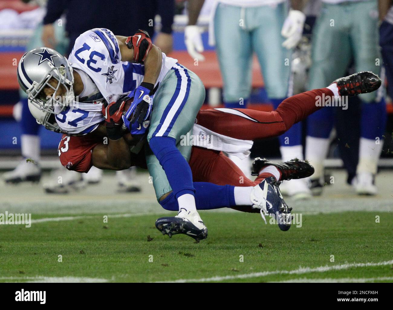 Arizona Cardinals cornerback Trumaine McBride (23) tackles Dallas ...