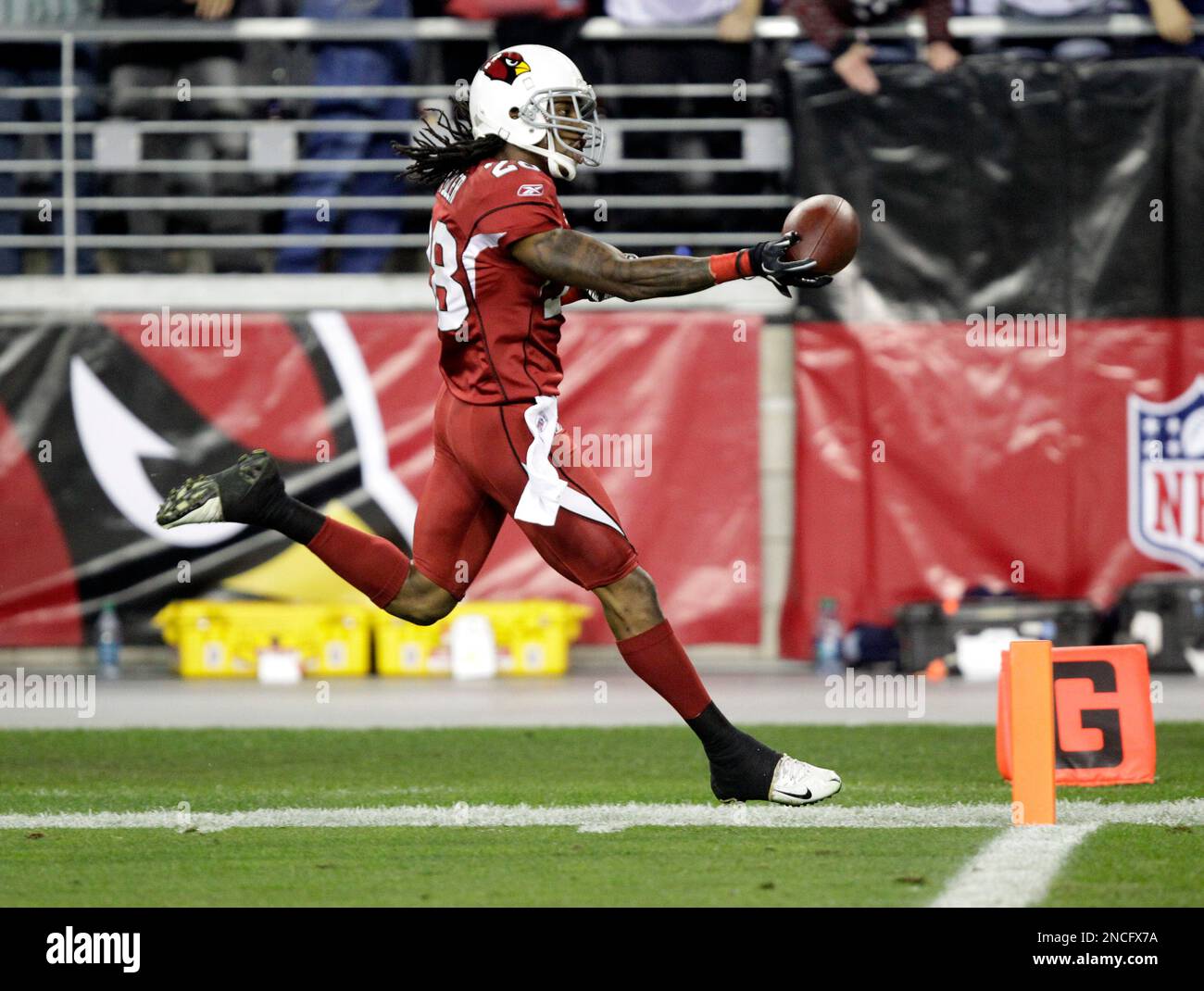 Arizona Cardinals cornerback Greg Toler runs back an interception for a ...