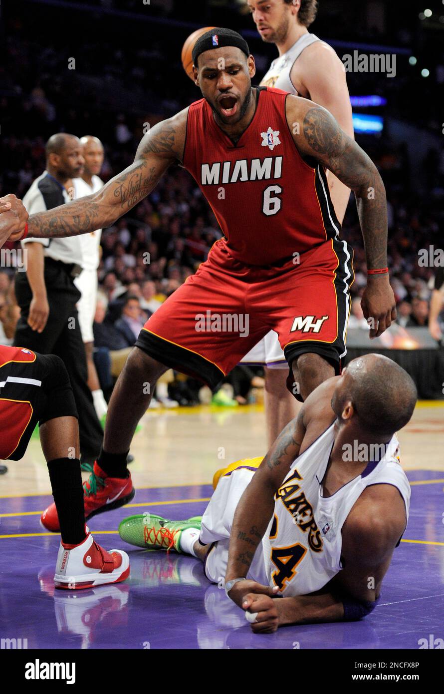 Miami Heat forward LeBron James, top, yells at Los Angeles Lakers guard ...