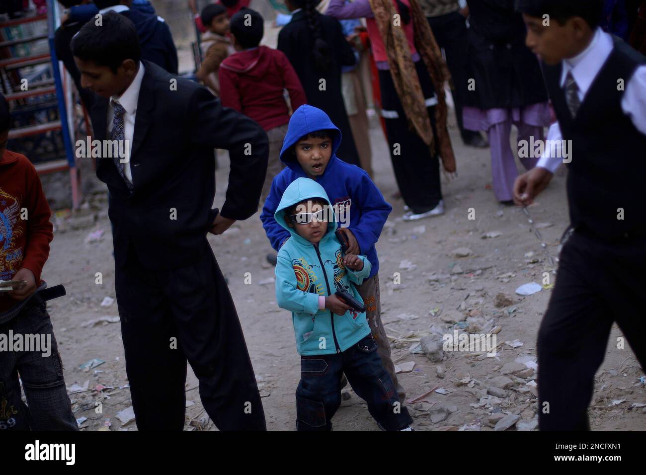 Pakistani children play with toy guns celebrating Christmas in a ...