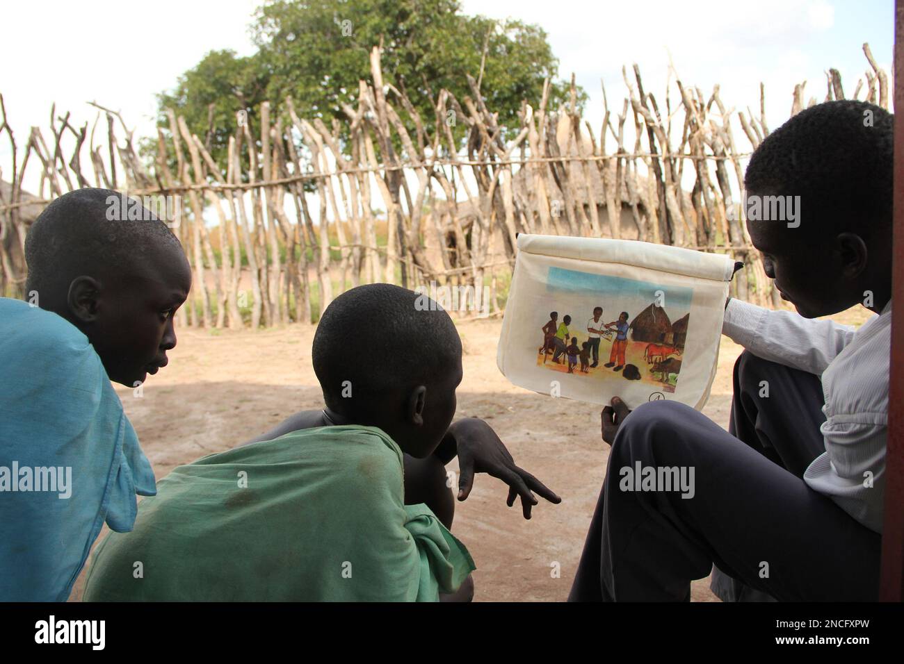 In this Nov. 4, 2010 photo, Isaiah Deng Mayom, right, a former guinea ...
