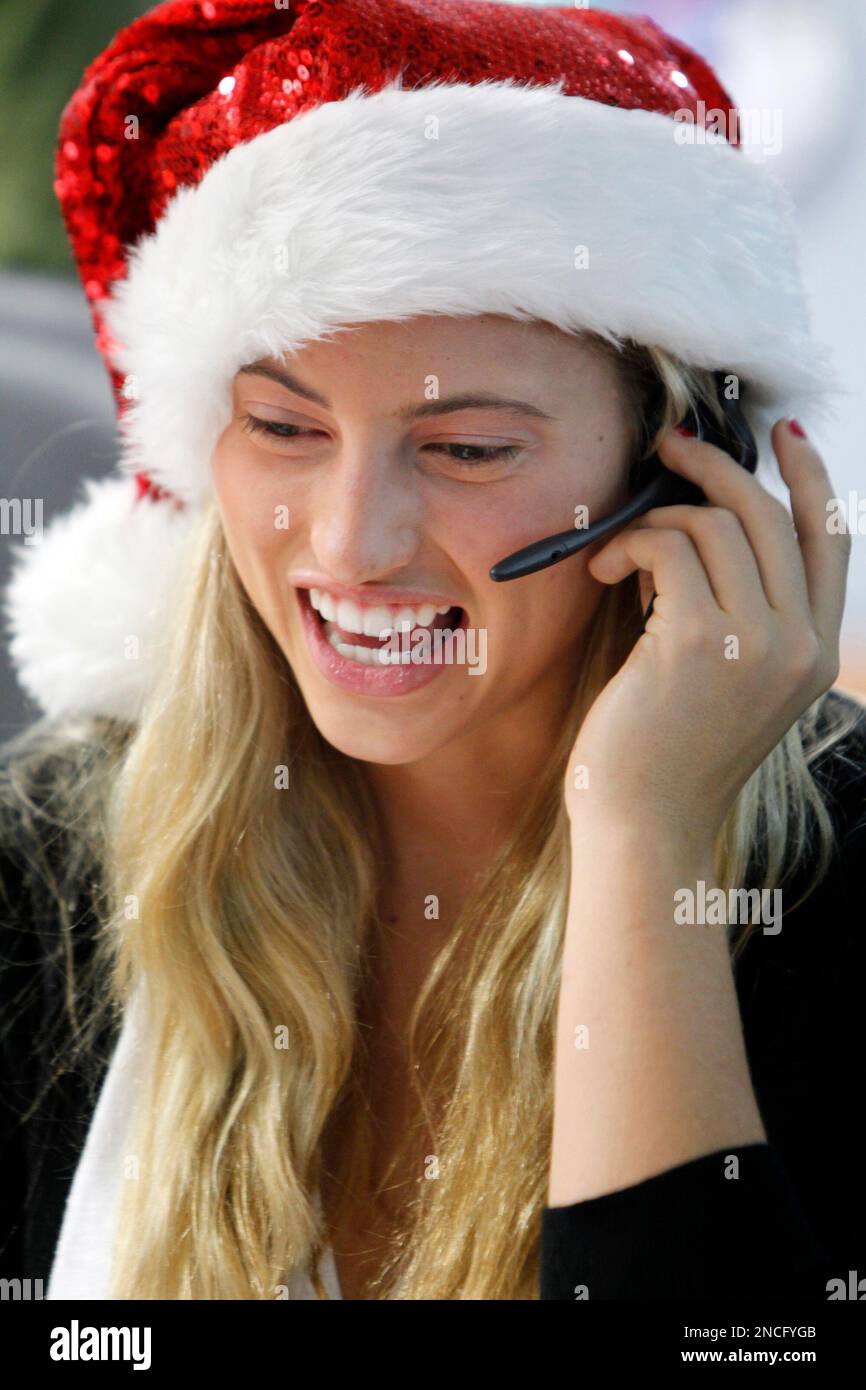 Volunteer Victoria Hokanson talks with a youngster about the location ...