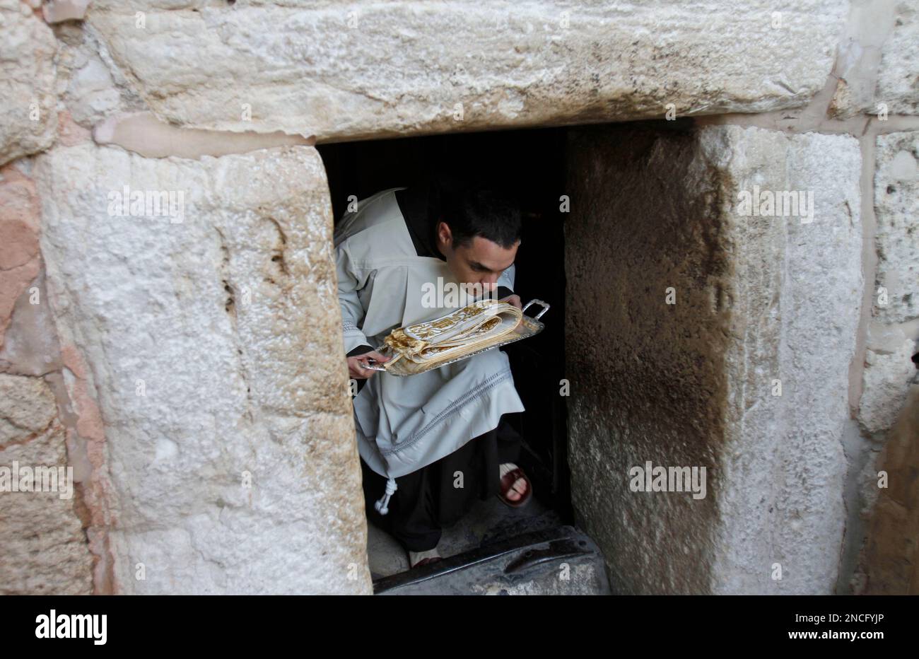 A Priest walks out the gate to welcome Latin Patriarch of Jerusalem ...