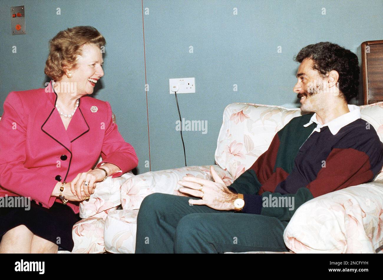 A smiling British Prime Minister Margaret Thatcher chats with AIDS ...