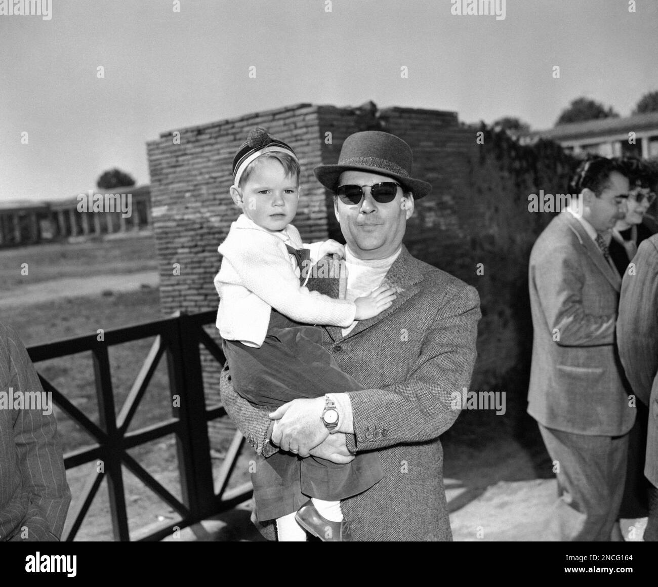 Italian film director, Roberto Rossellini holds his two and one half ...