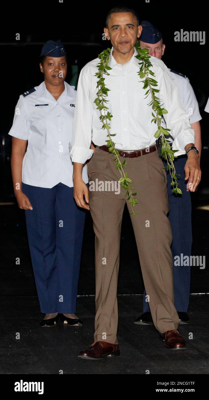 President Barack Obama stands on the tarmac after deplaning from Force ...