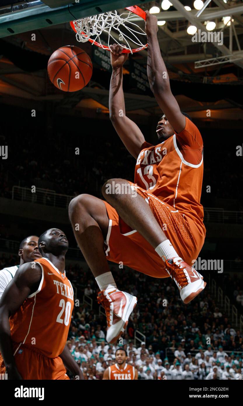 Texas' Tristan Thompson, right, dunks over teammate Alexis Wangmene (20 ...