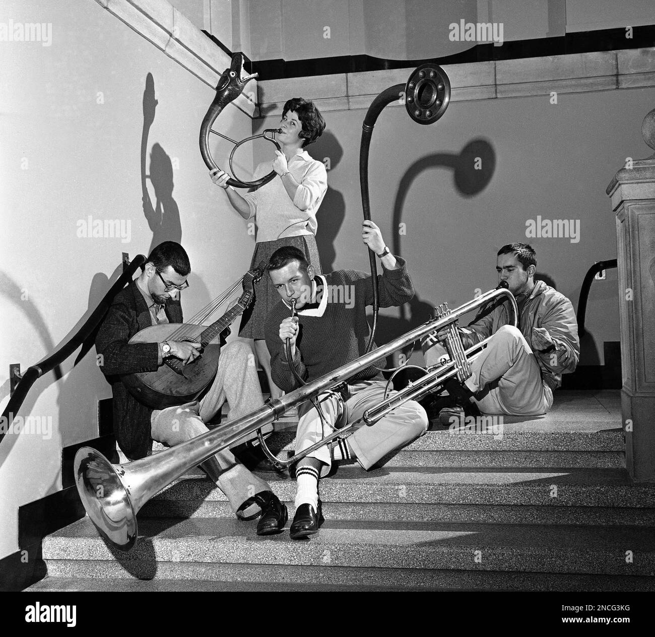 Blowing and strumming on musical instruments one rarely sees or hears ...