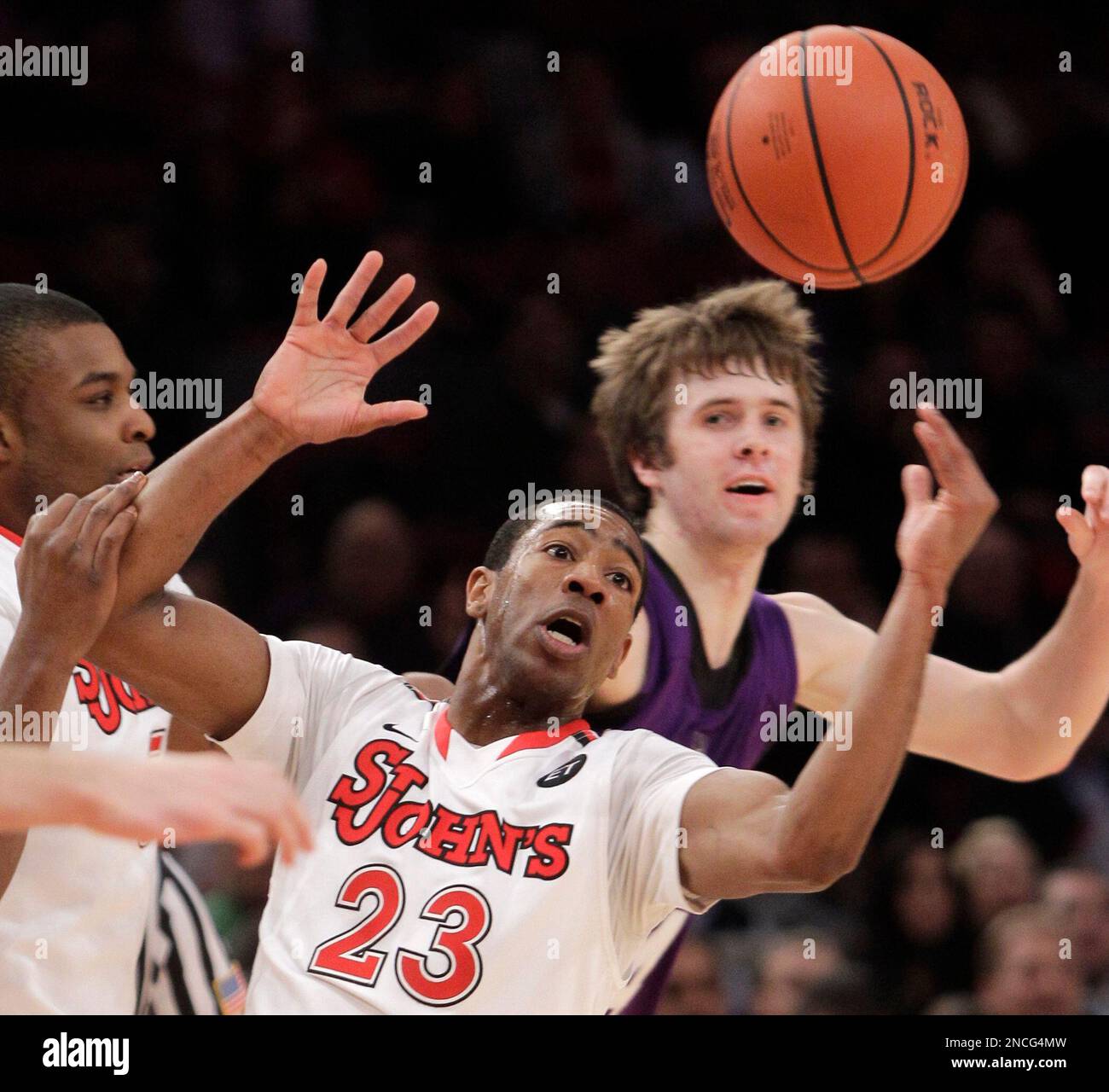 St. John's guard Paris Horne (23) and Northwestern forward John Shurna ...