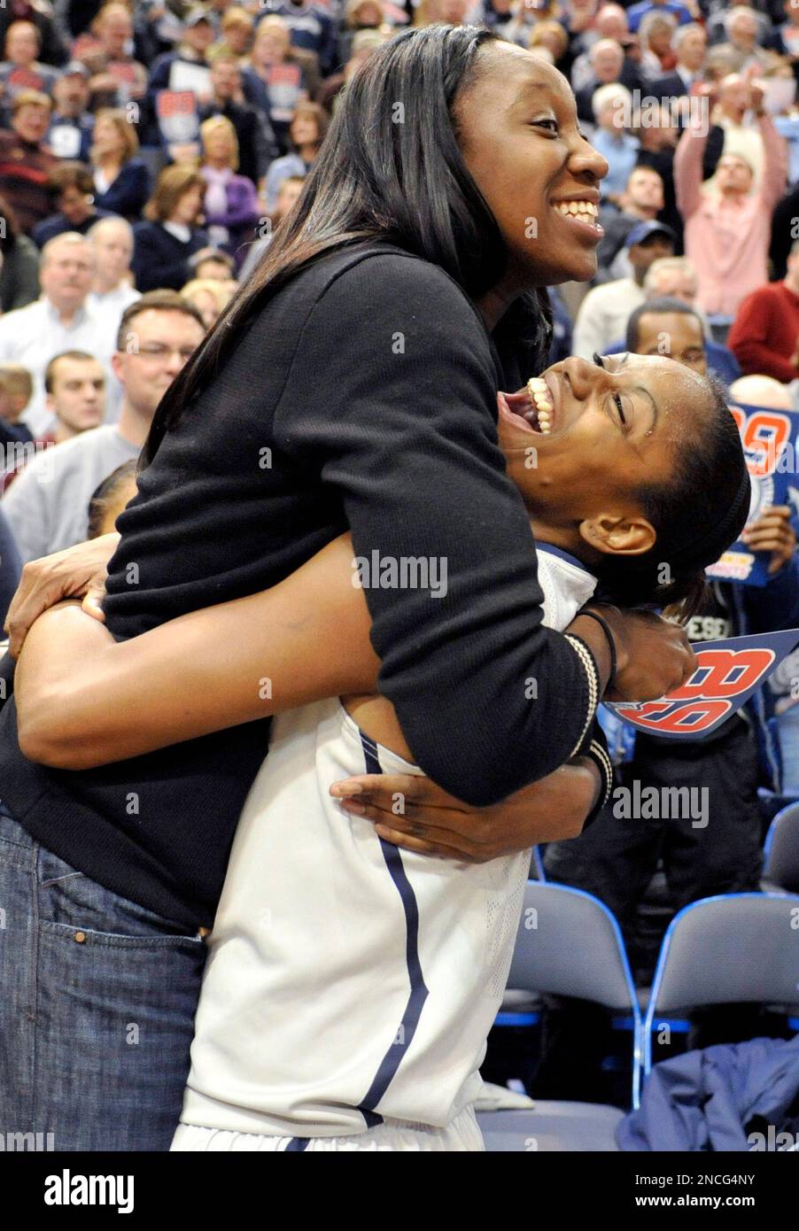 Former Connecticut basketball player Tina Charles, left, hugs ...