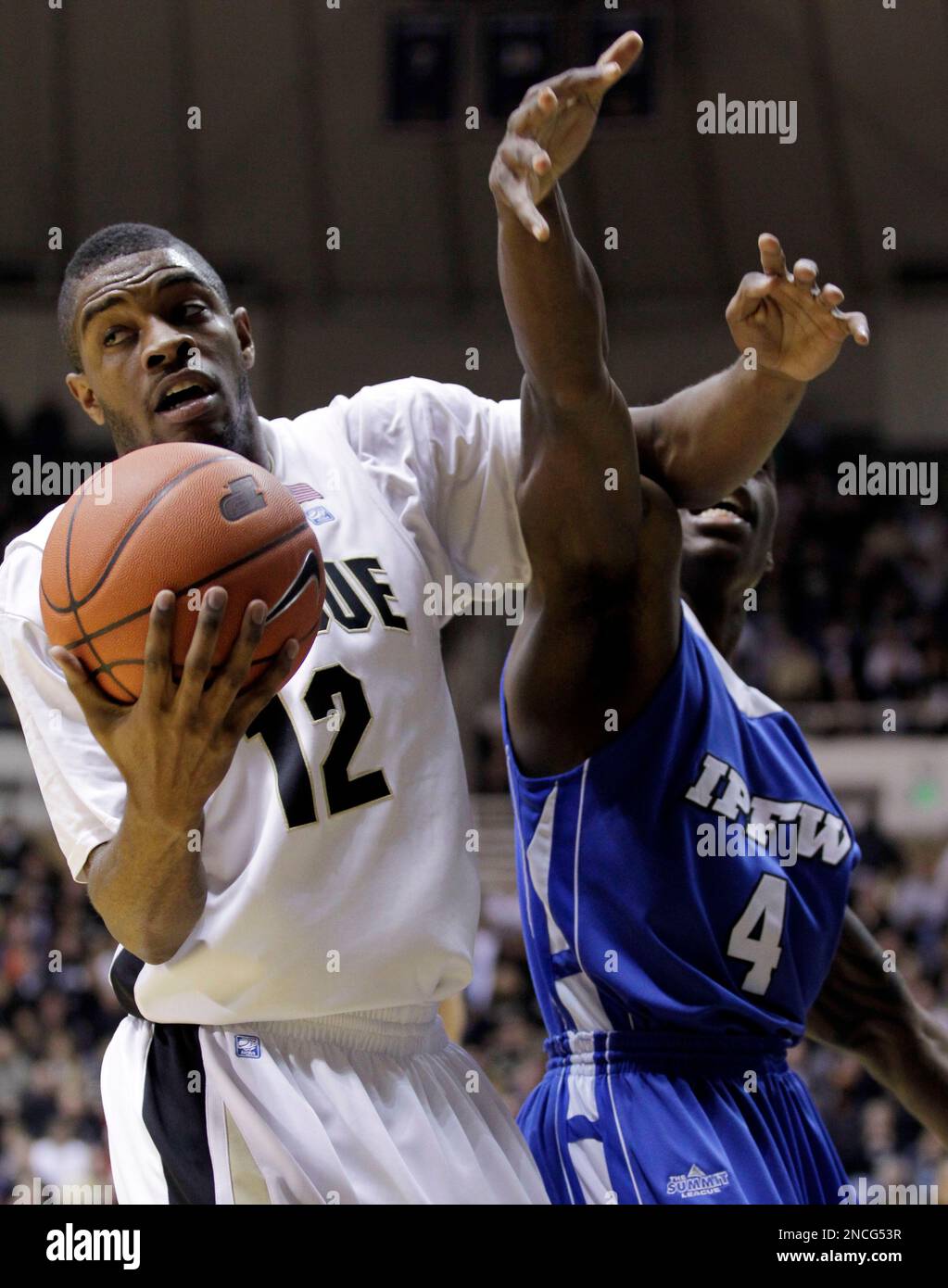 Purdue guard Kelsey Barlow, left, and IPFW guard Frank Gaines get ...