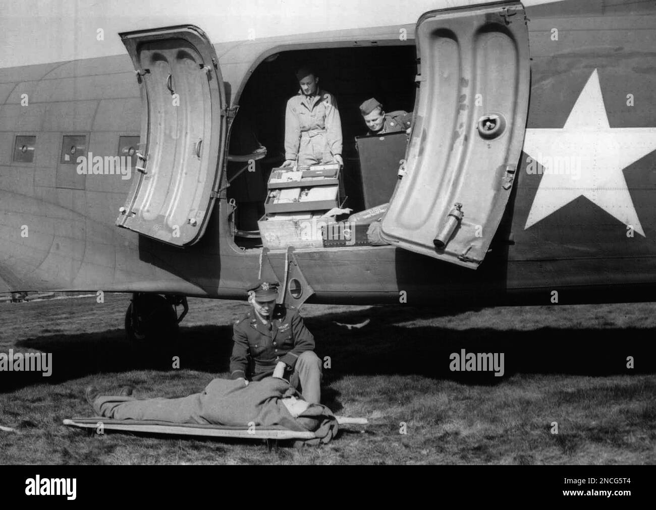 A casualty about to be loaded into a new U.S. Army Air Force emergency ...