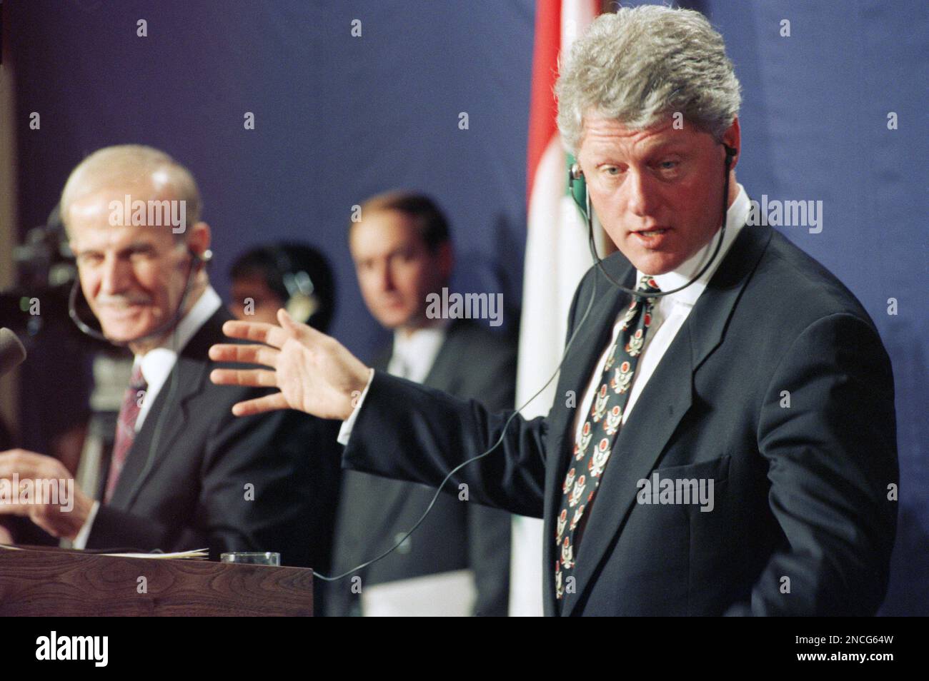 U.S. President Bill Clinton gestures towards Syria's President Hafez ...