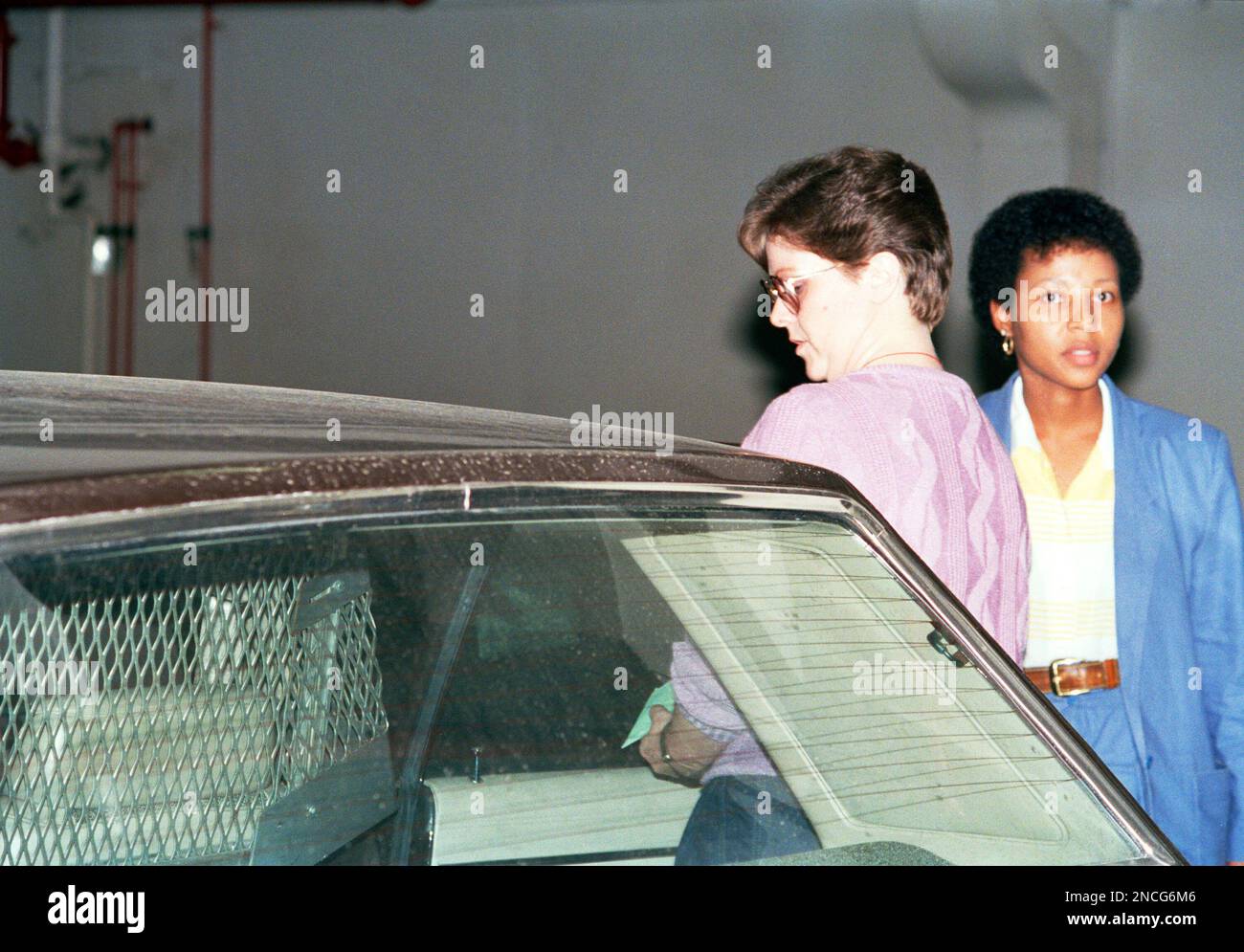 Samantha Lopez gets into a U.S. Marshal’s vehicle following her ...