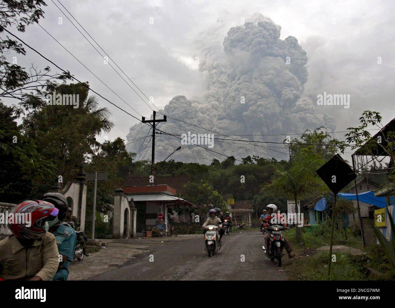 FILE -In this Oct. 31, 2010 file photo, motorists ride as pyroclastic ...