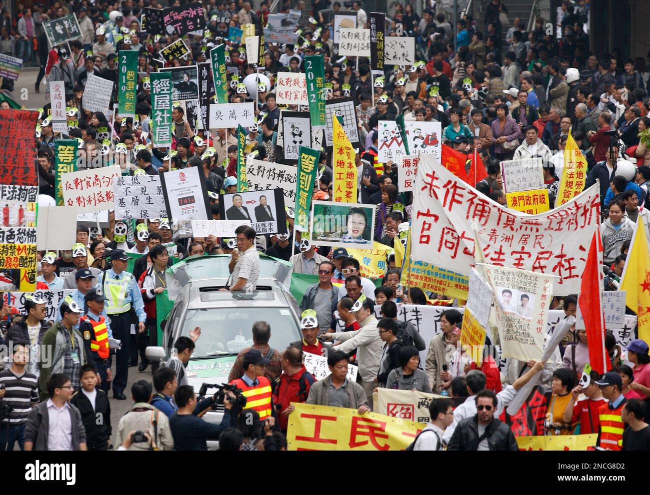Hundreds of protesters march during a demonstration to mark the ...
