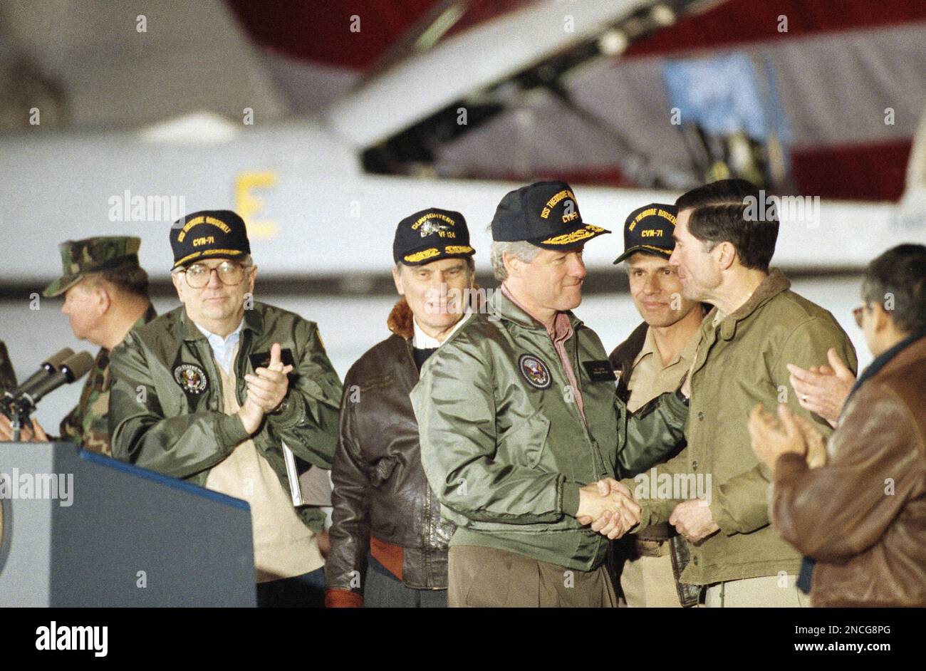 U.S. President Bill Clinton shakes hands with Sen. Charles Robb, D-Va ...